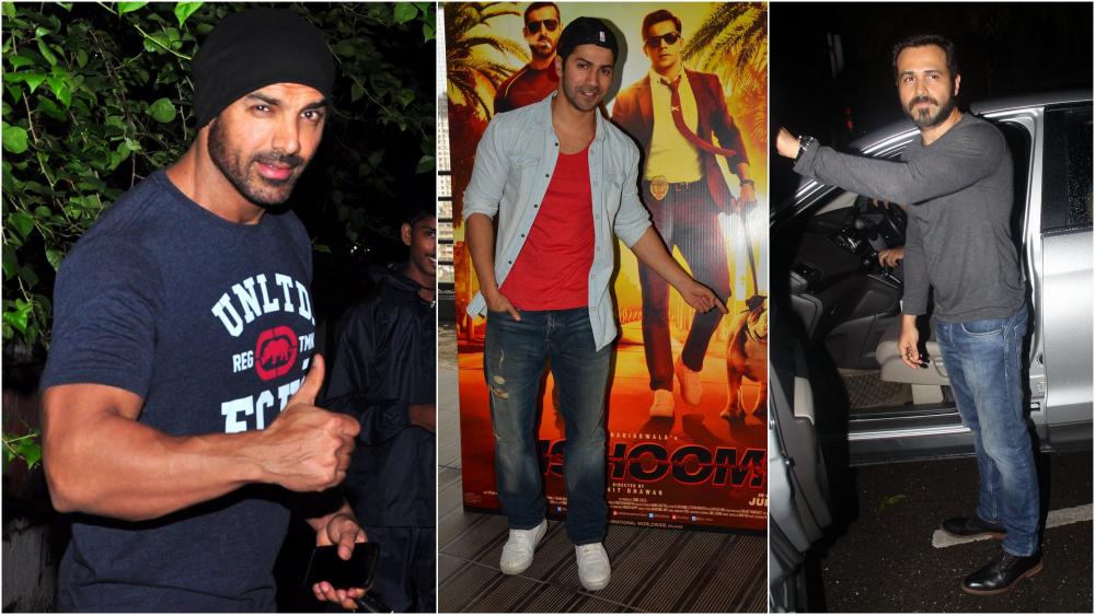 Varun poses for shutterbugs, while John and Emraan caught off guard